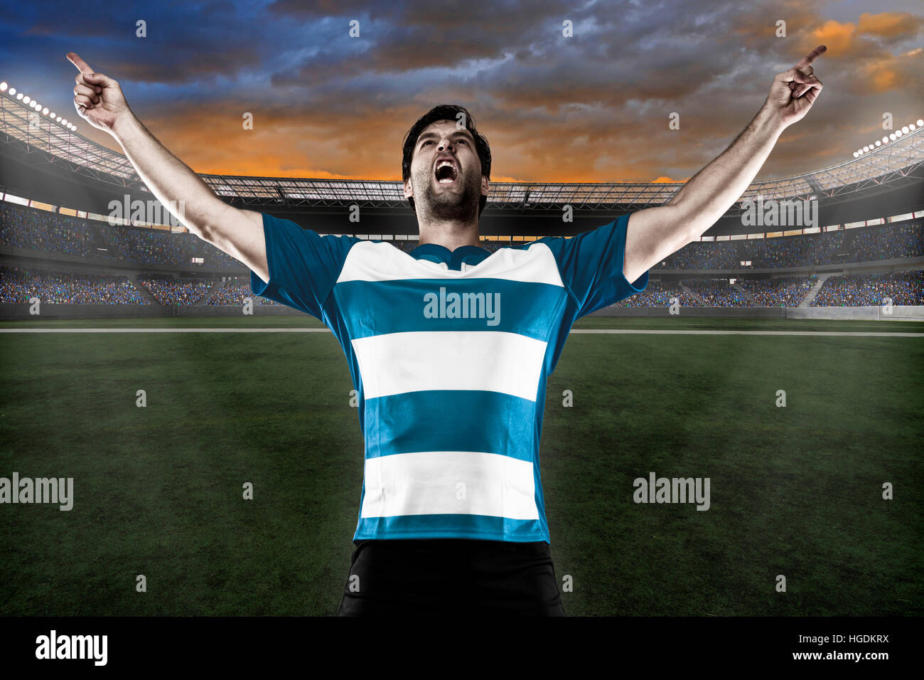 Rugby player in a blue uniform celebrating on a stadium Stock Photo - Alamy