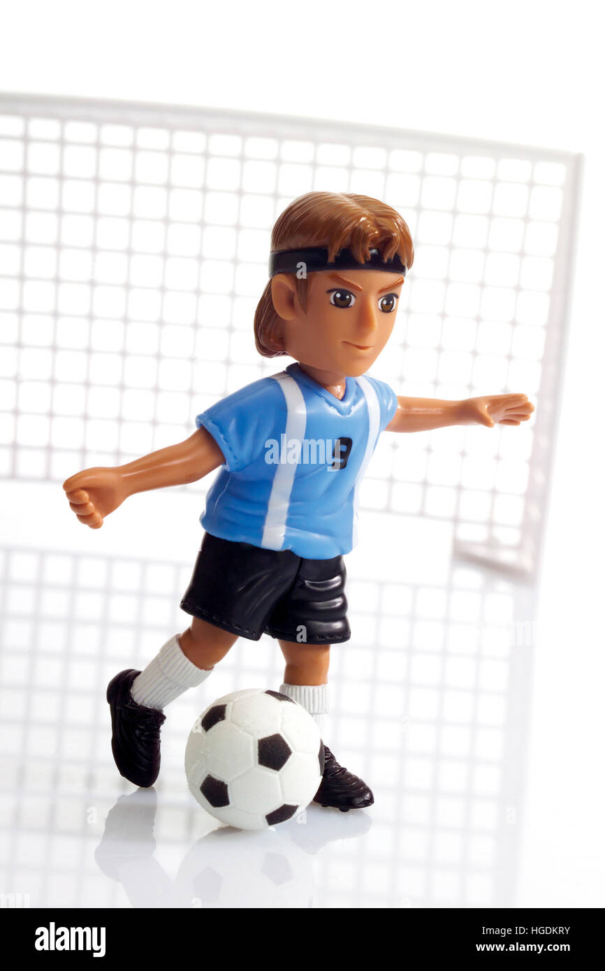 Football player with ball in front of the goal Stock Photo - Alamy