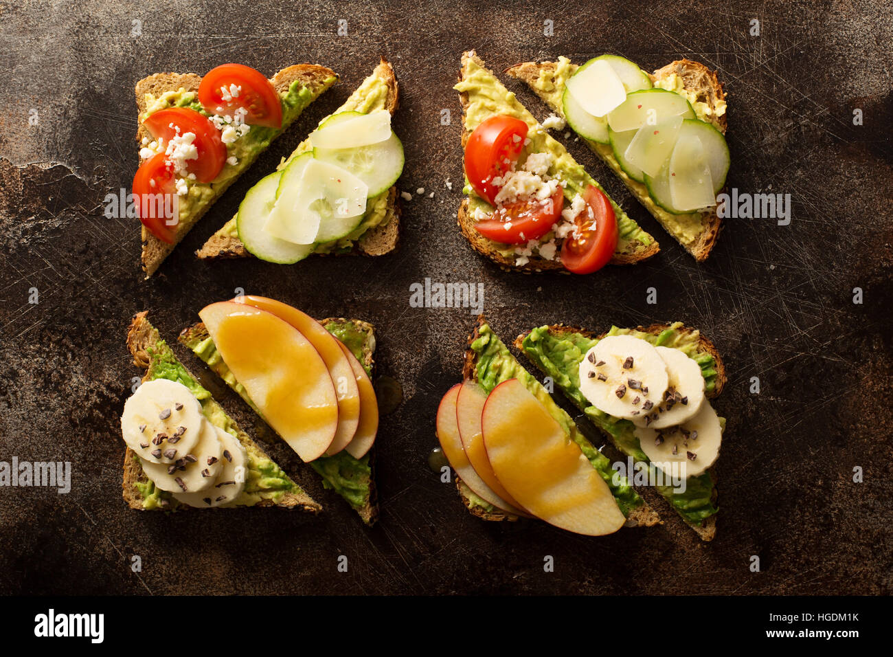 Avocado toast with various fruit and vegetable toppings Stock Photo - Alamy
