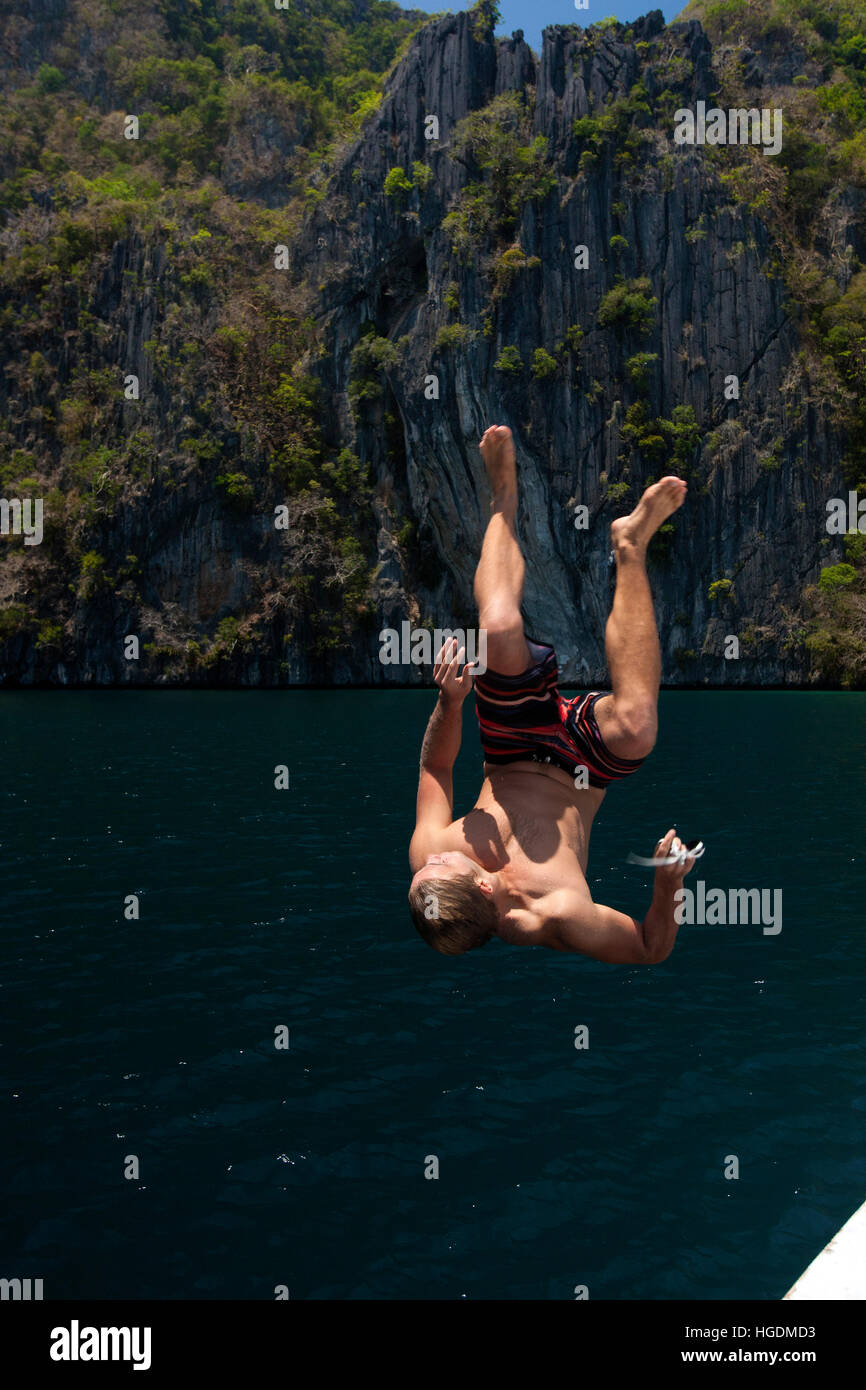 Young man jumping into sea Bacuit Archipelago Palawan Philippines Stock ...