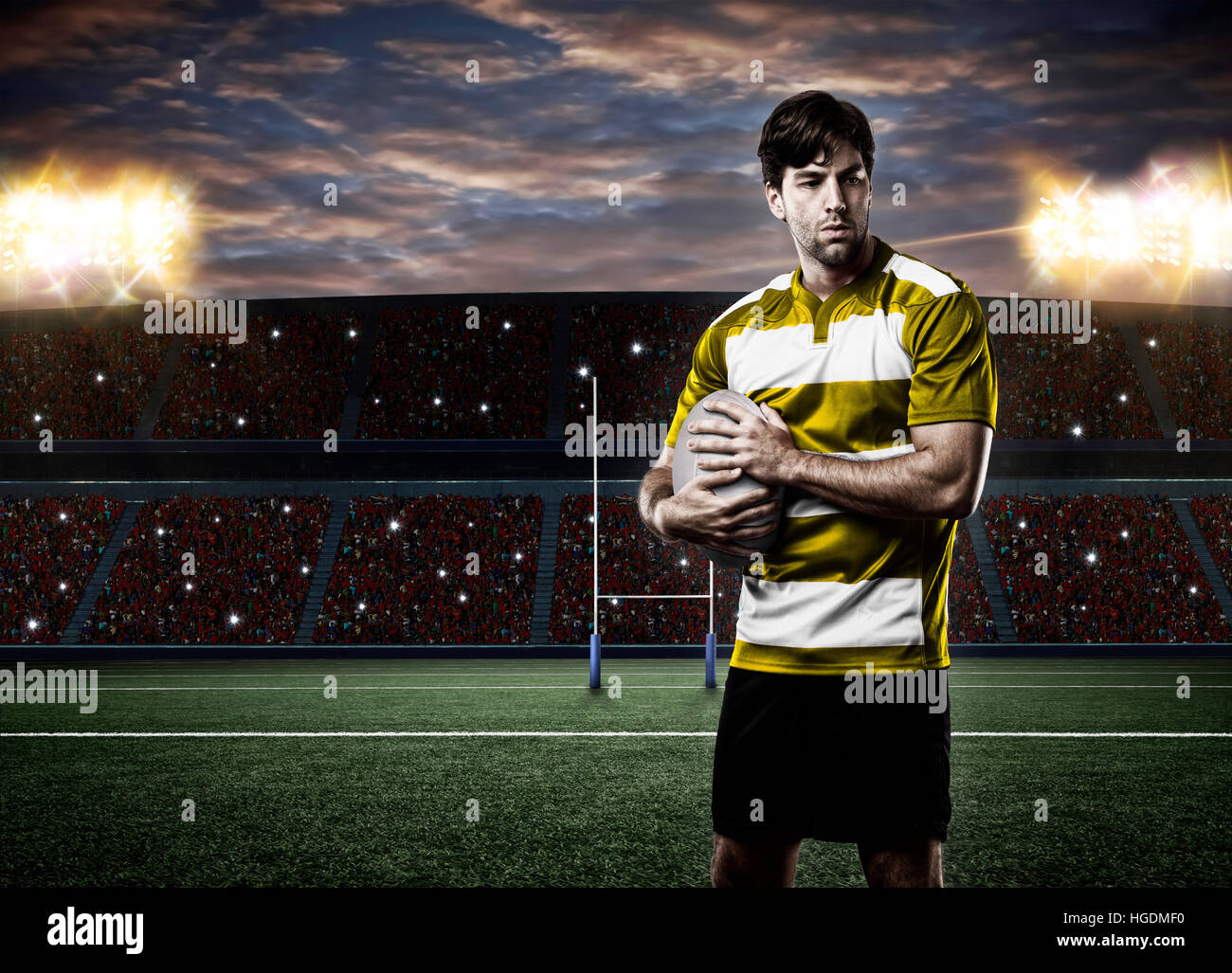Rugby player in a yellow uniform on a stadium Stock Photo - Alamy