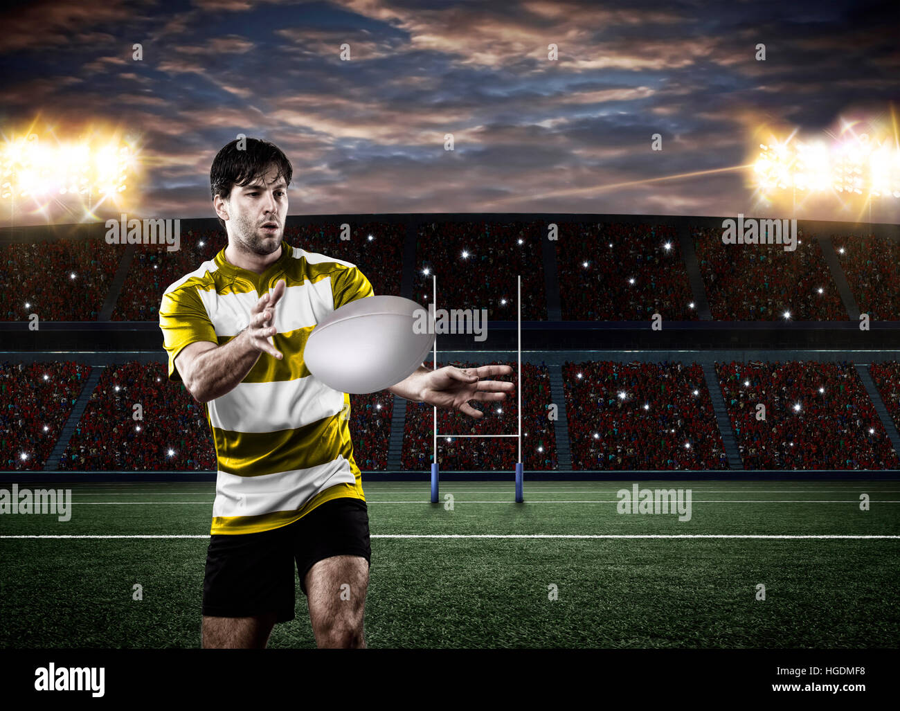 Rugby player in a yellow uniform on a stadium Stock Photo - Alamy