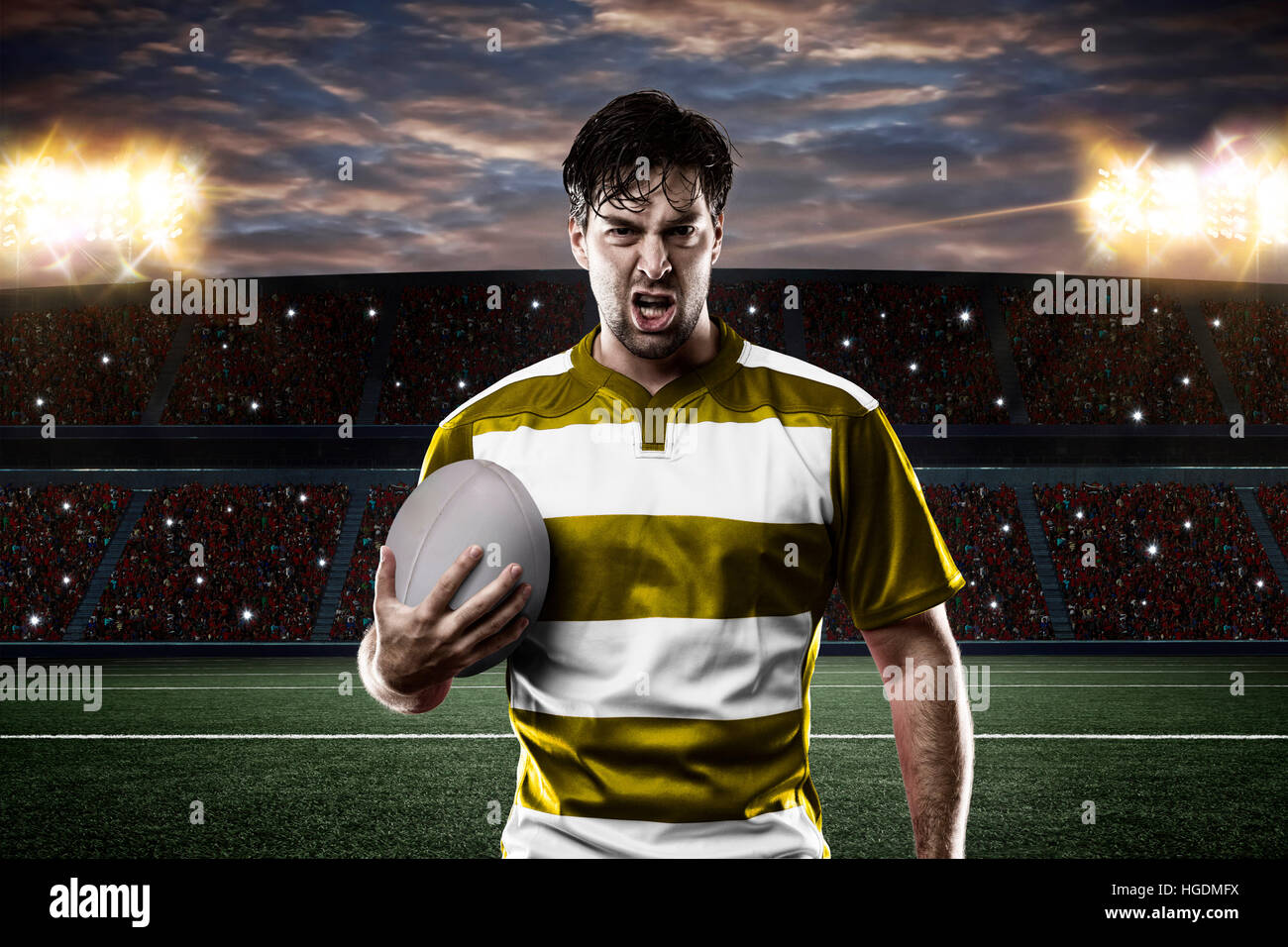 Rugby player in a yellow uniform on a stadium Stock Photo - Alamy