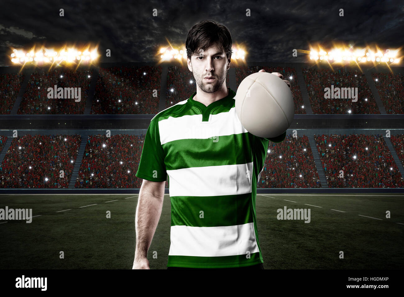 Rugby player in a green uniform on a stadium Stock Photo - Alamy