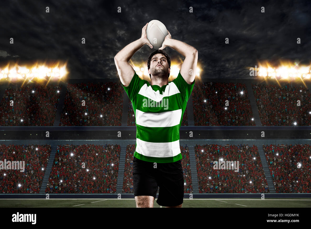 Rugby player in a green uniform on a stadium Stock Photo - Alamy