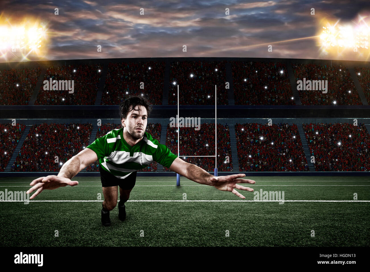 Rugby player in a green uniform giving a tackle on a stadium Stock ...