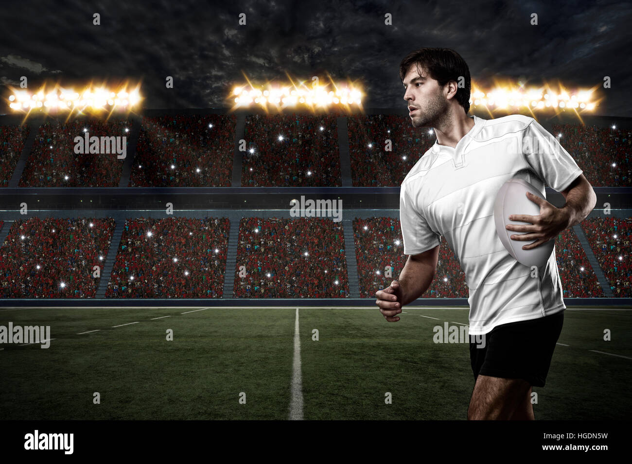 Rugby player in a white uniform on a stadium Stock Photo - Alamy