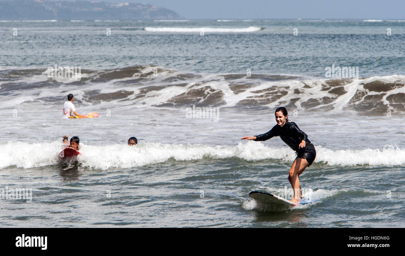 Surfing Kuta Beach Bali Indonesia Stock Photo - Alamy