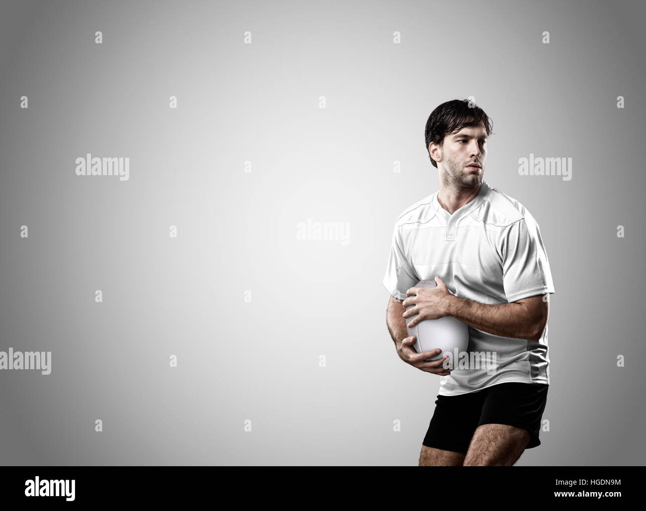 Rugby player in a white uniform on a white background Stock Photo - Alamy