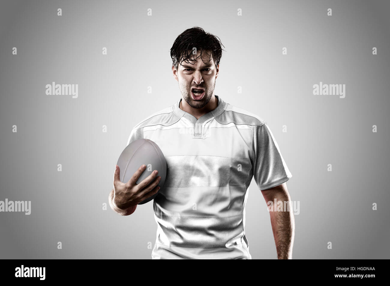 Rugby player in a white uniform on a white background Stock Photo - Alamy