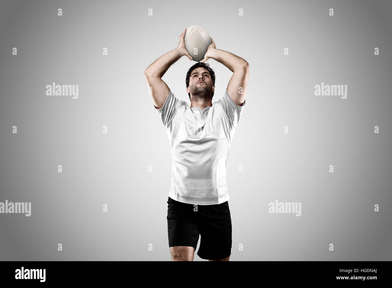 Rugby player in a white uniform on a white background Stock Photo - Alamy