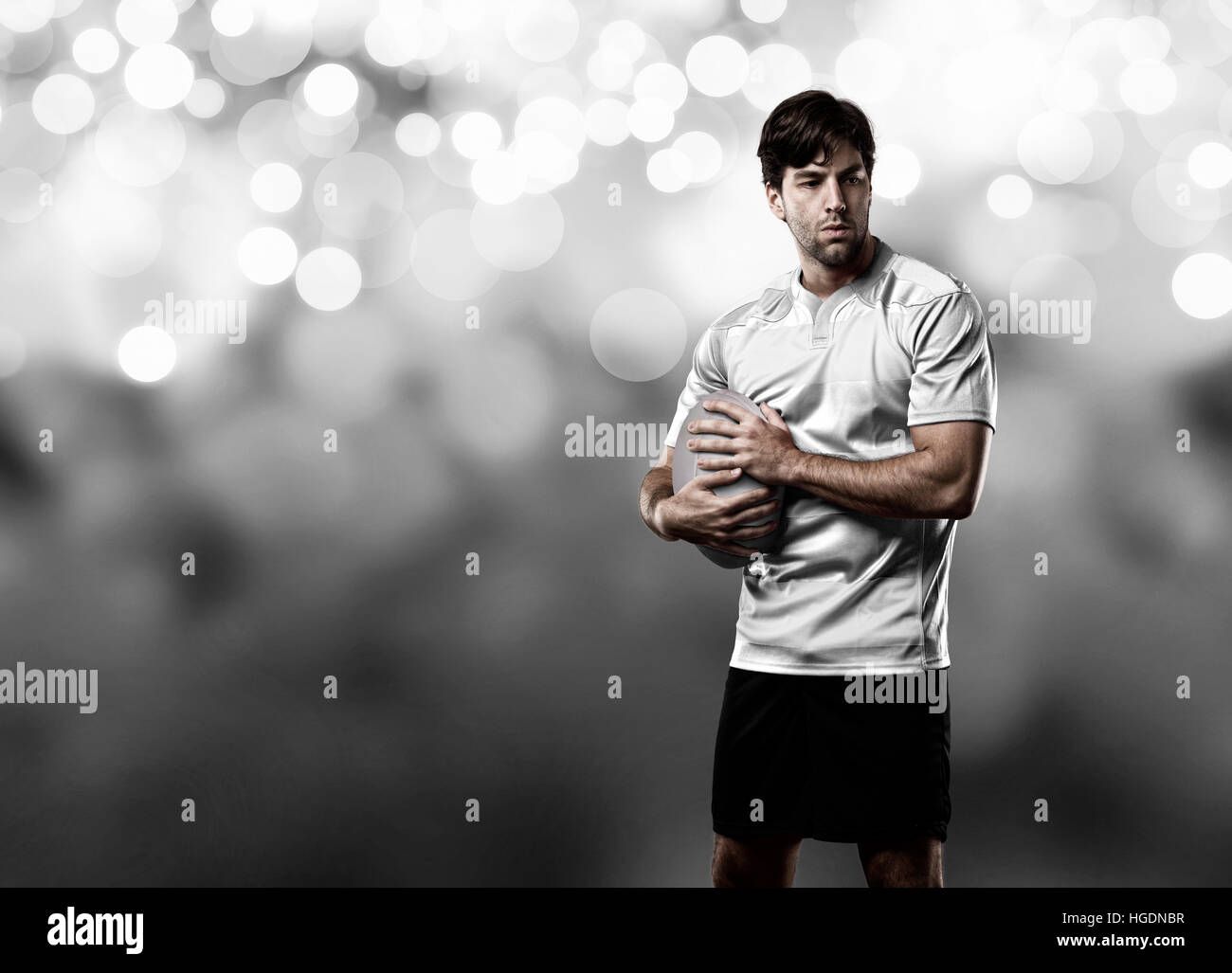 Rugby player in a white uniform on a white lights background Stock ...