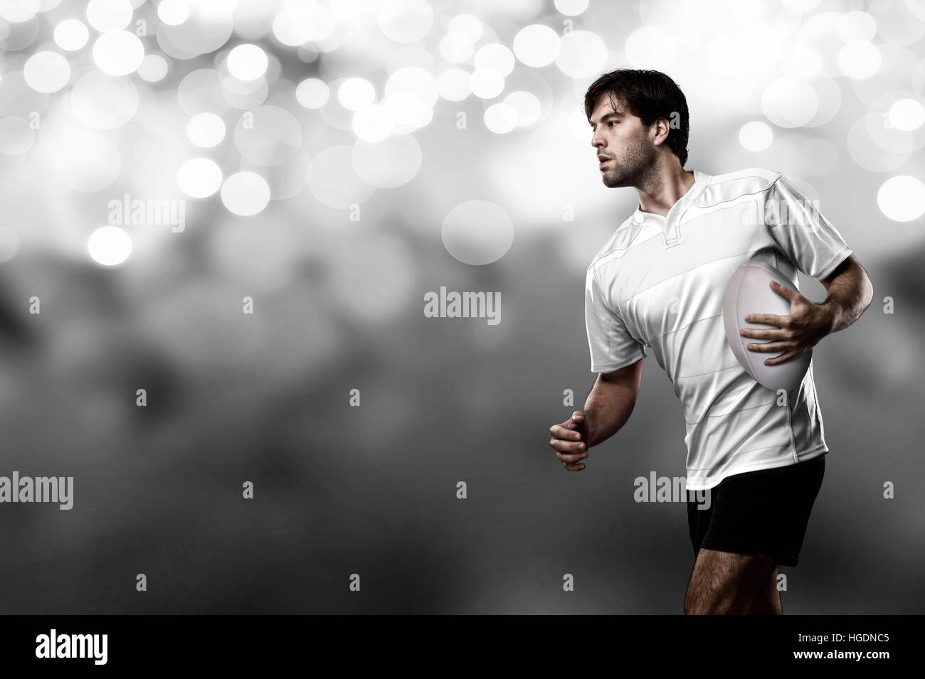 Rugby player in a white uniform on a white lights background Stock ...