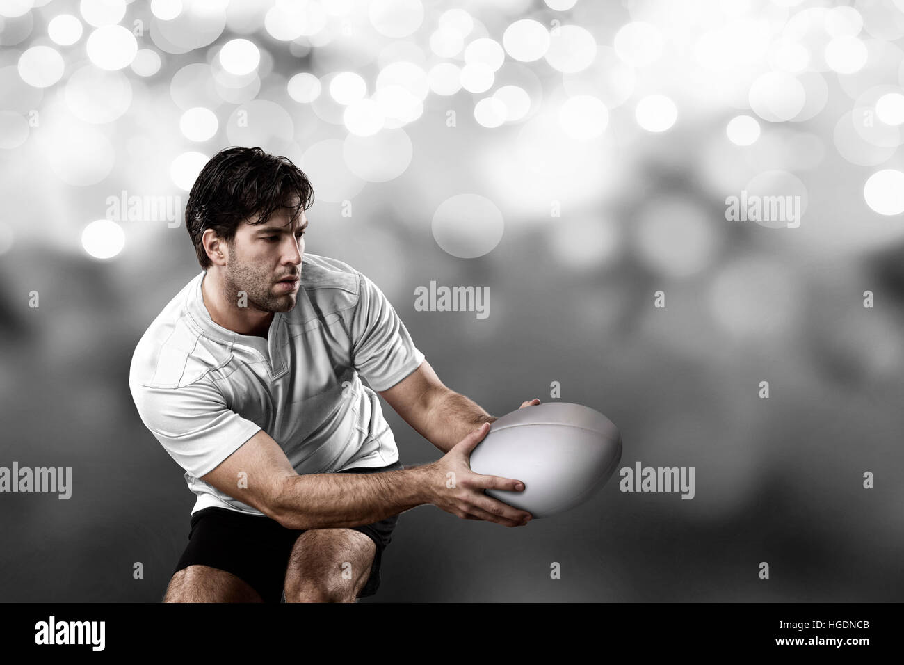 Rugby player in a white uniform on a white lights background Stock ...
