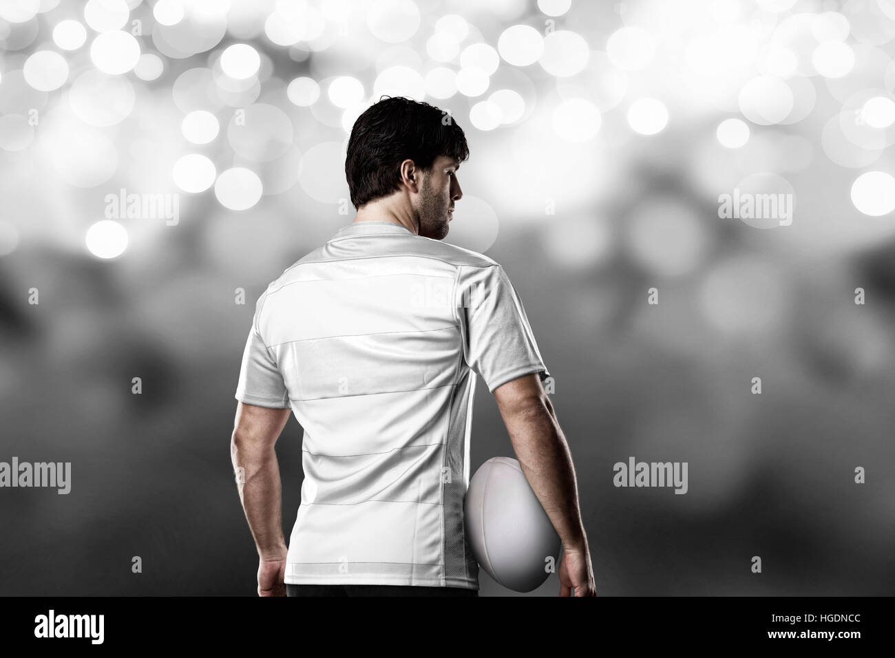 Rugby player in a white uniform on a white lights background Stock ...