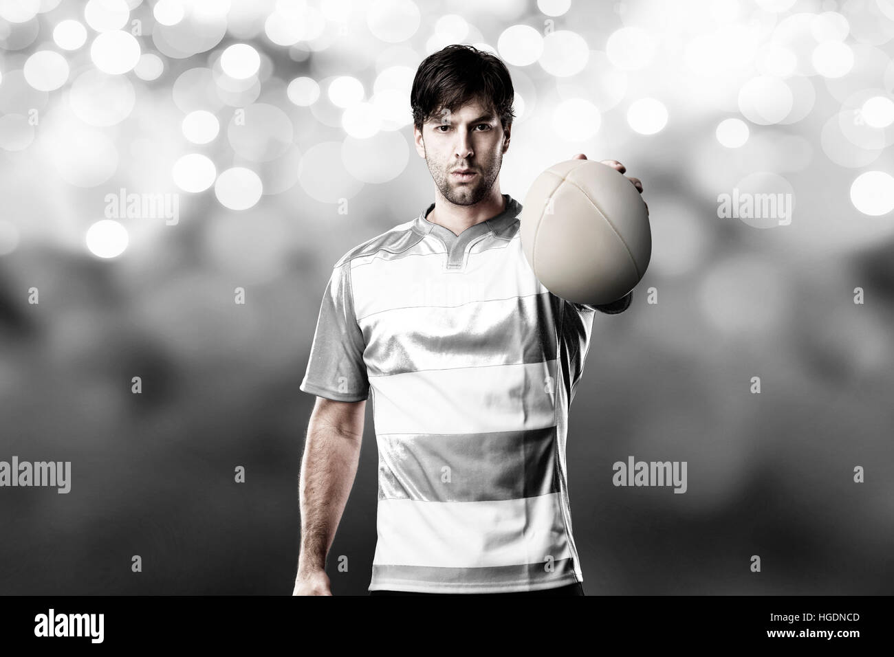 Rugby player in a white uniform on a white lights background Stock ...
