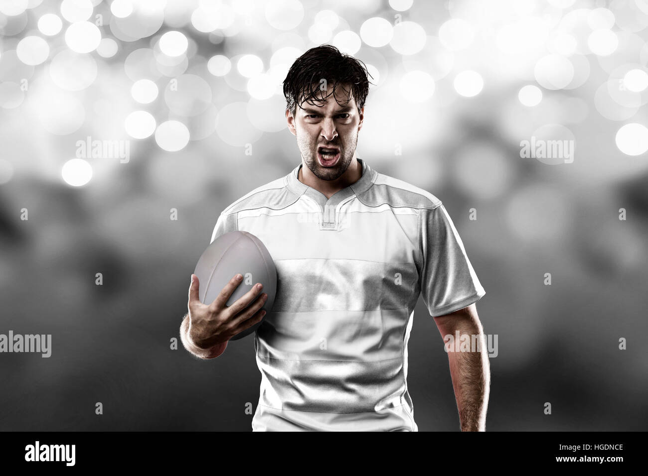 Rugby player in a white uniform on a white lights background Stock ...