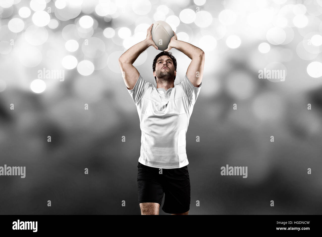 Rugby player in a white uniform on a white lights background Stock ...
