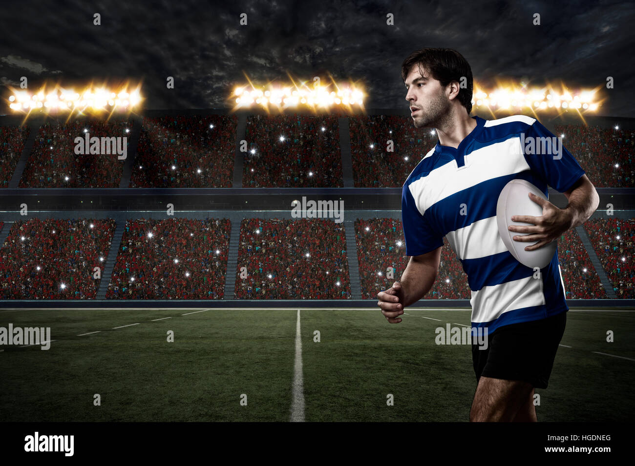 Rugby player in a blue uniform on a stadium Stock Photo - Alamy