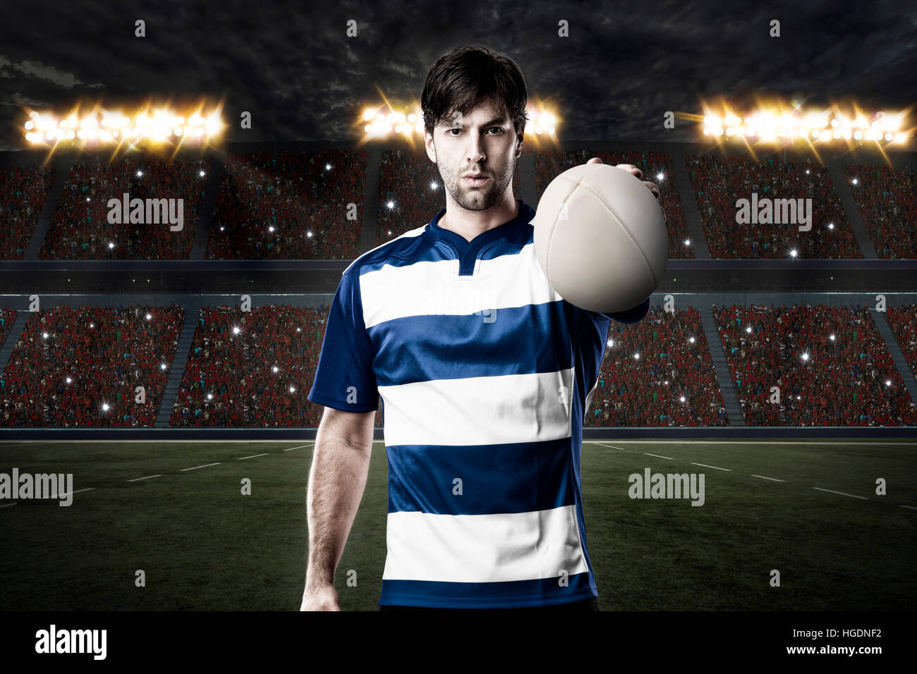 Rugby player in a blue uniform on a stadium Stock Photo - Alamy