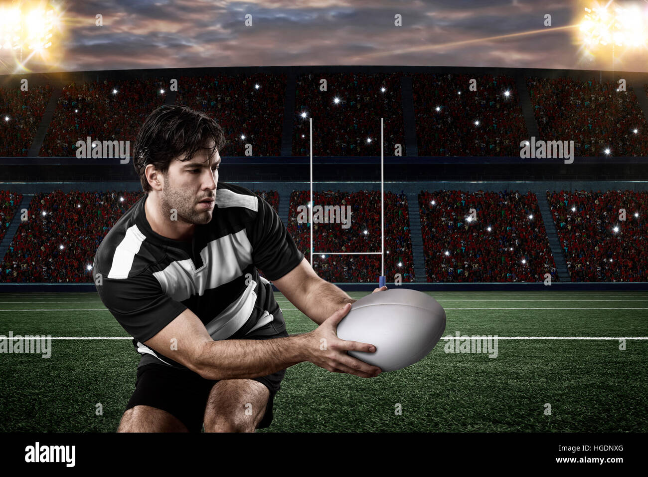 Rugby player in a black uniform on a stadium Stock Photo - Alamy