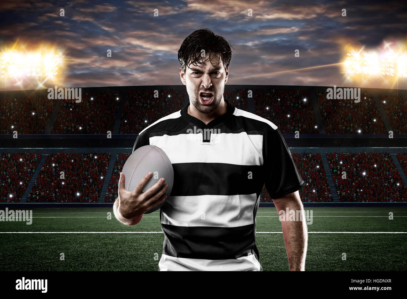 Rugby player in a black uniform on a stadium Stock Photo - Alamy