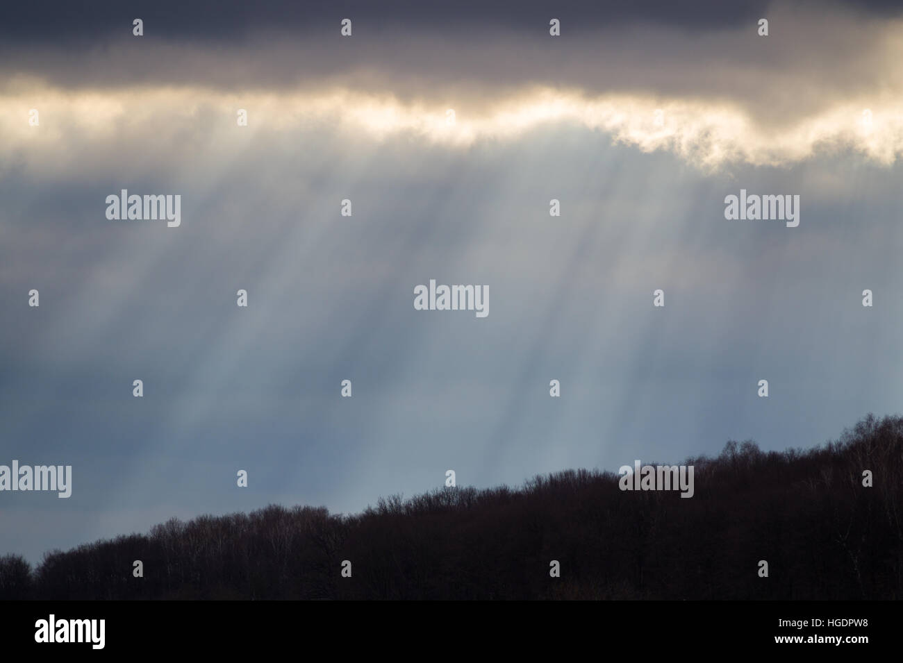 Sun rays through storm clouds hi-res stock photography and images - Alamy