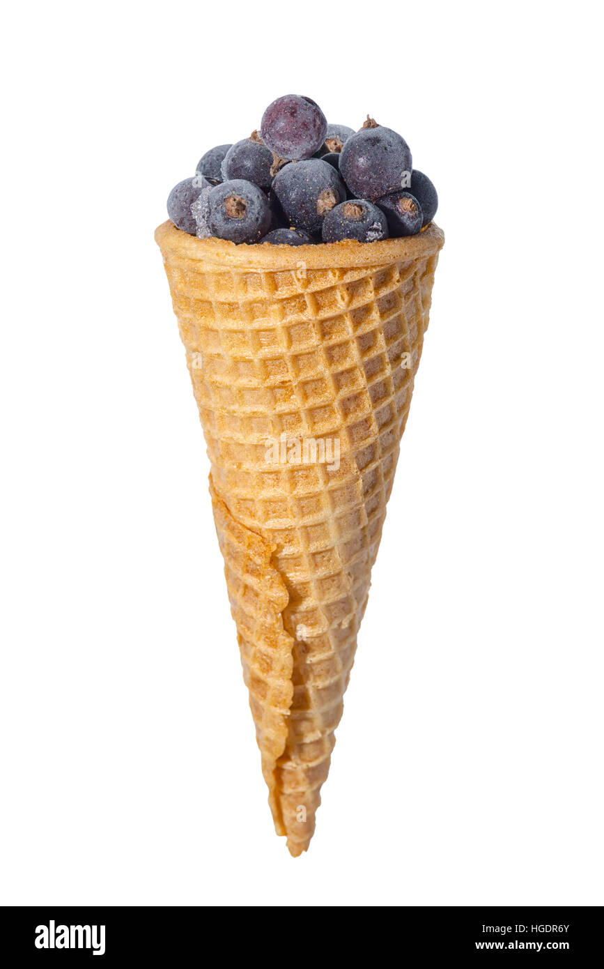 waffle cone with frozen currant berries isolated on white background ...
