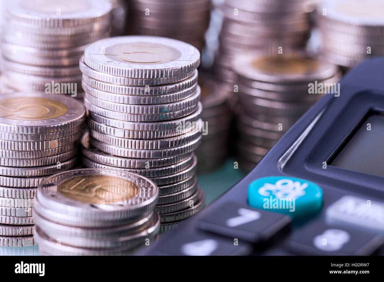 Couns and calculator on white background. Studio shot Stock Photo - Alamy