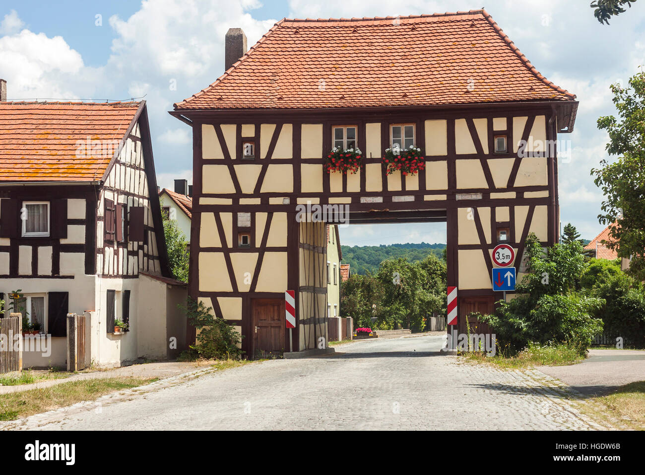 Building over the road in rural Germany village. Old house as example ...