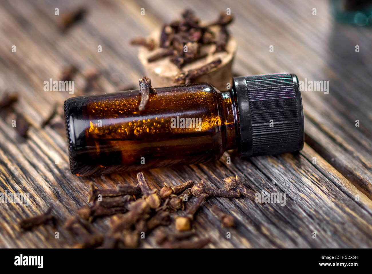 Clove essential oil and cloves aromatic flower buds Stock Photo - Alamy