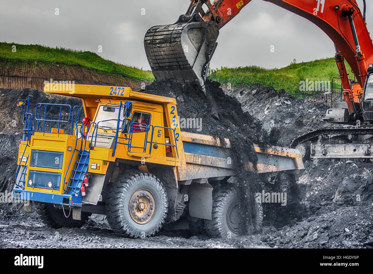 NOVOKUZNETSK, RUSSIA - JULY 26, 2016: Big yellow mining trucks and ...