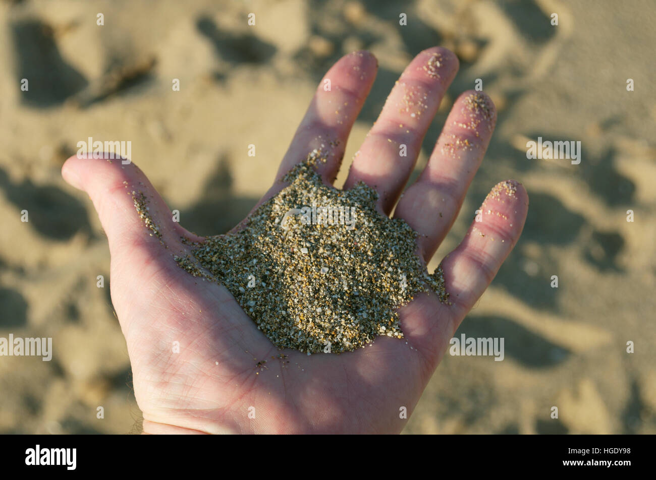 sand in the hand Stock Photo - Alamy