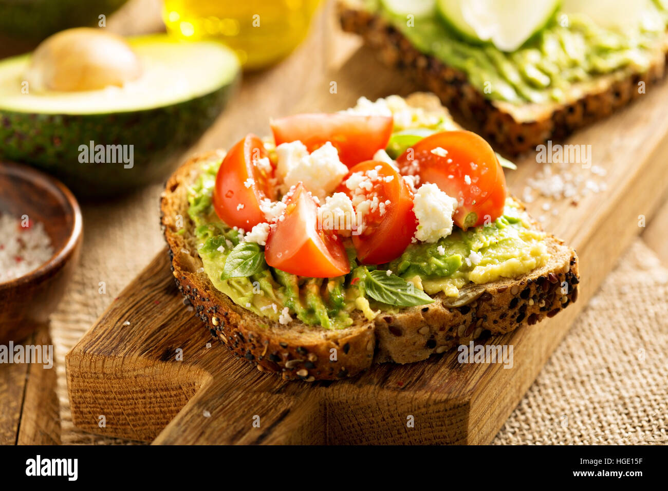 Avocado toast with tomatoes and feta Stock Photo - Alamy