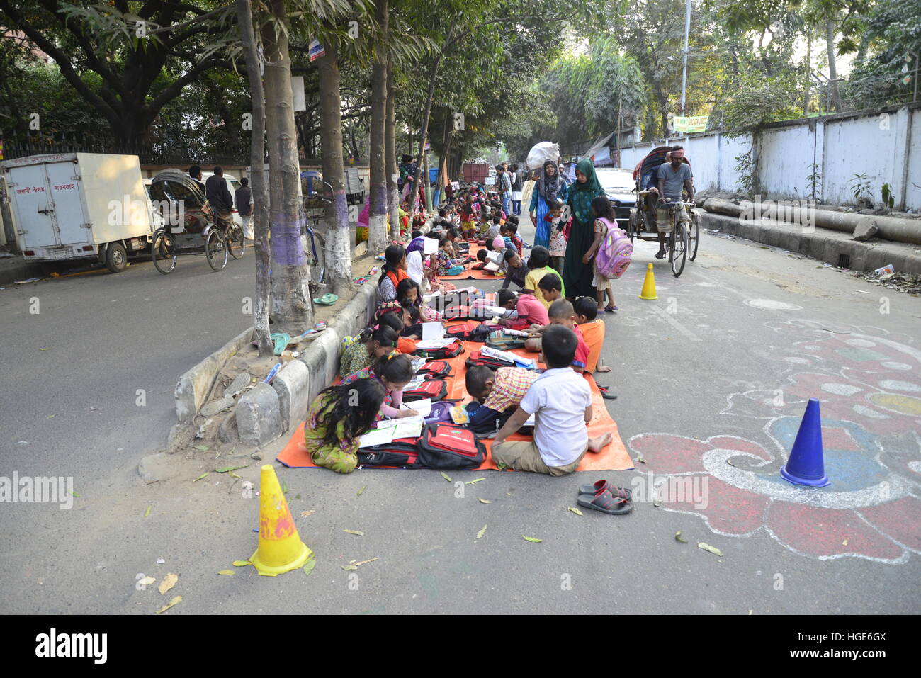 Dhaka, Bangladesh. 08th Jan, 2017. A group of street children studies ...