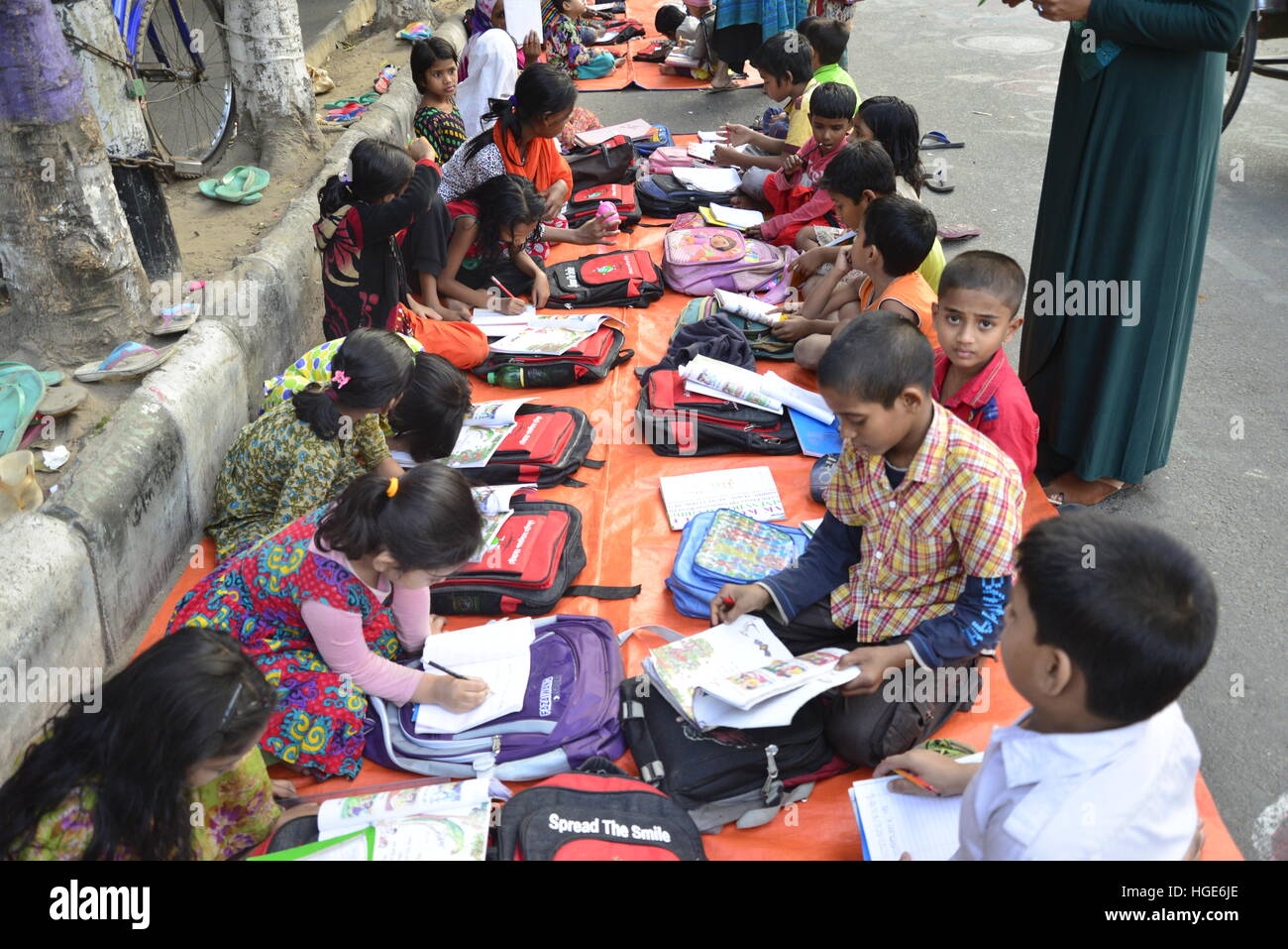 Dhaka, Bangladesh. 08th Jan, 2017. A group of street children studies ...