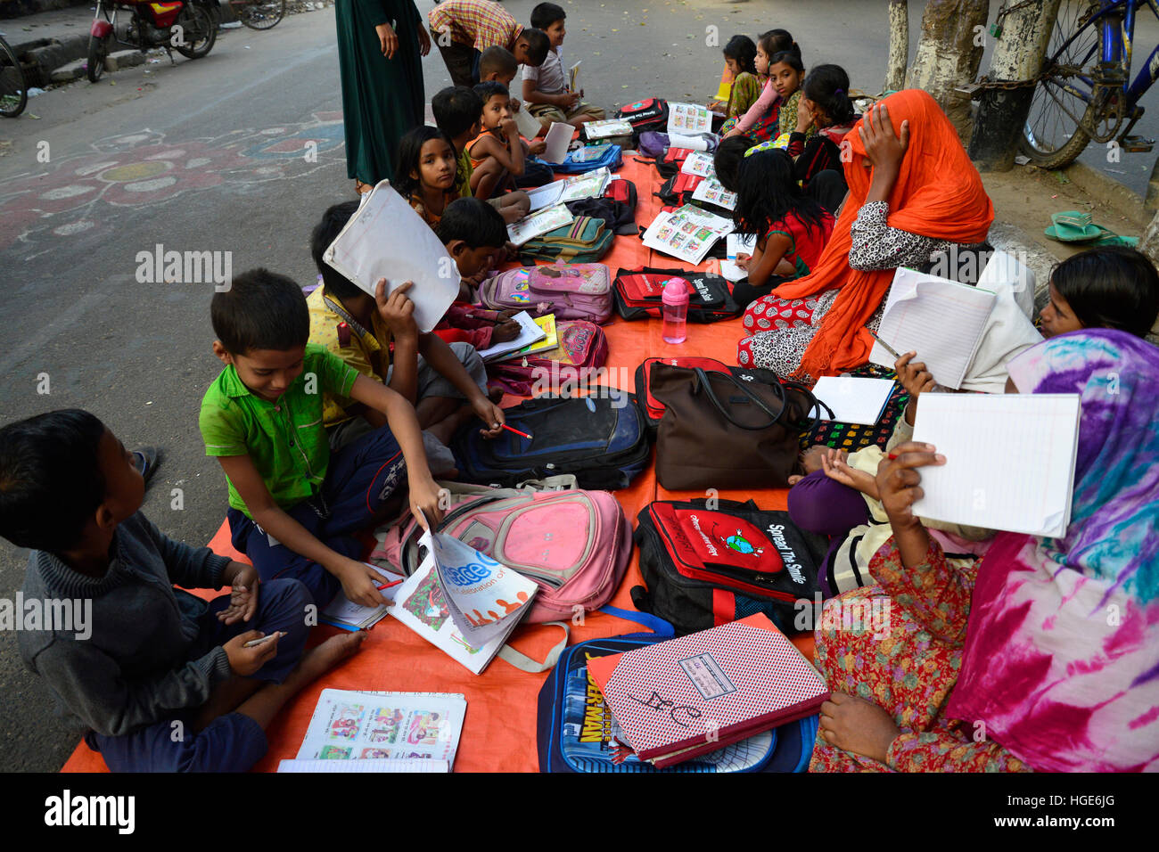 Dhaka, Bangladesh. 08th Jan, 2017. A group of street children studies ...