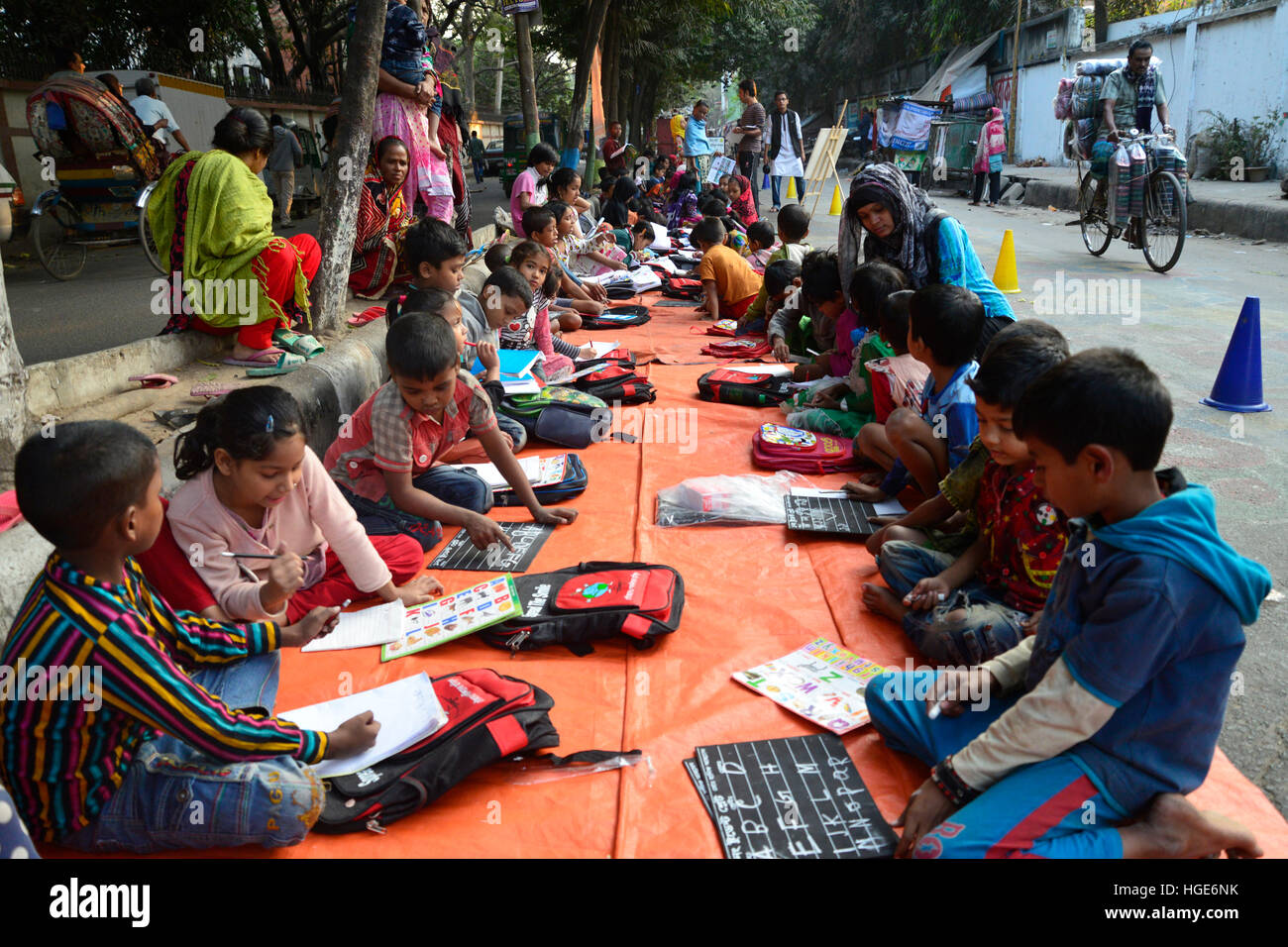 Dhaka, Bangladesh. 08th Jan, 2017. A group of street children studies ...