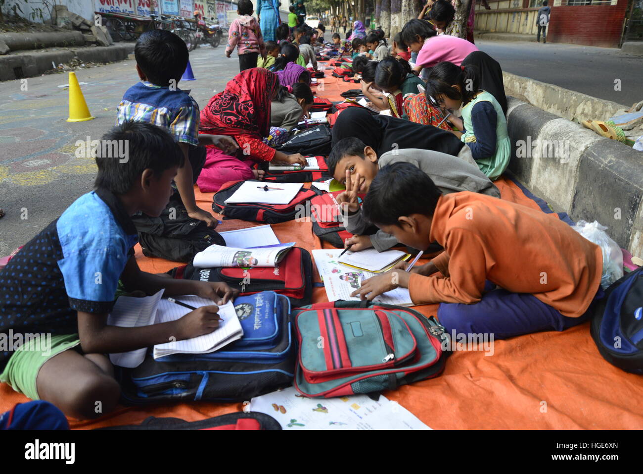 Dhaka, Bangladesh. 08th Jan, 2017. A group of street children studies ...