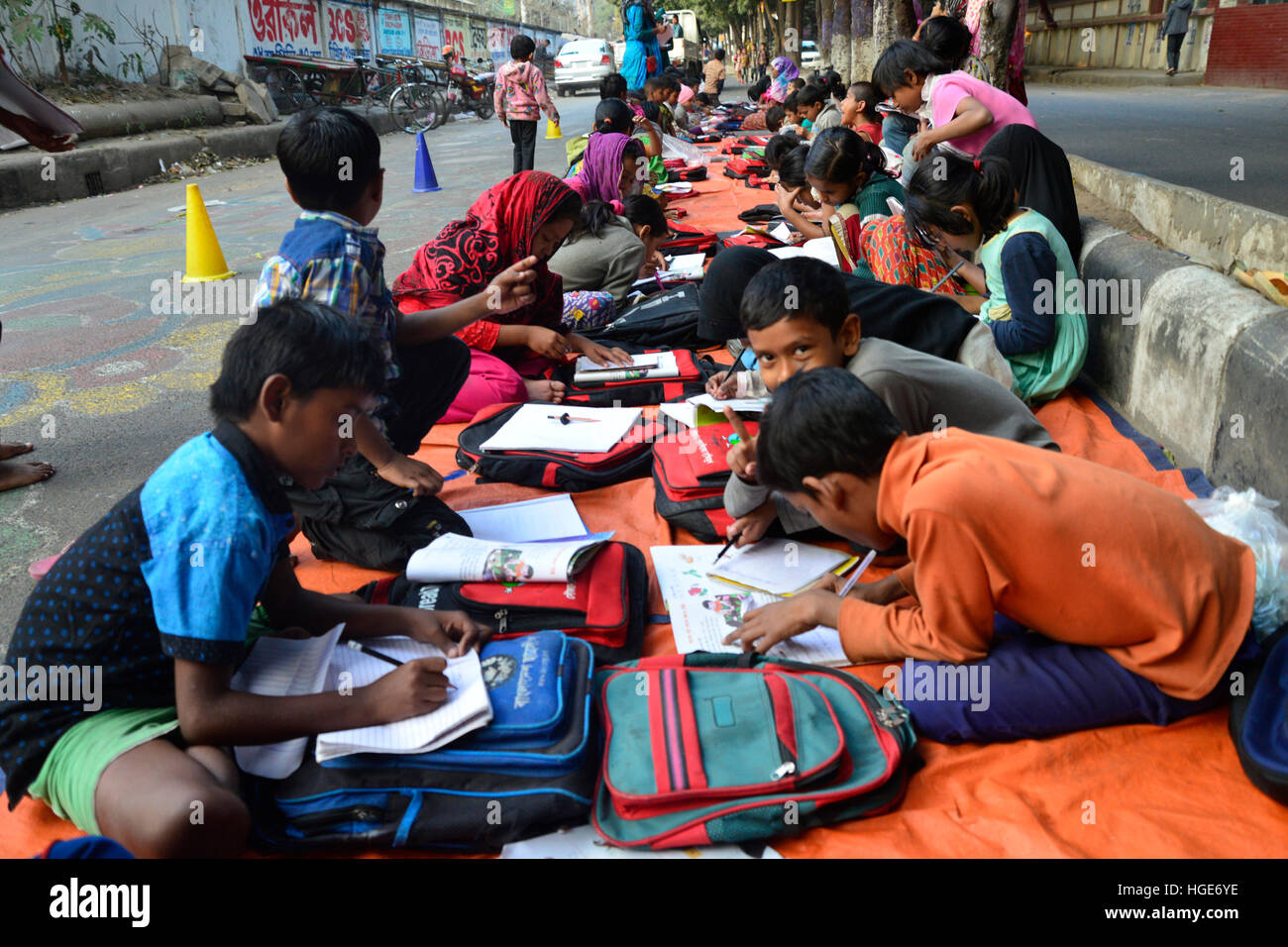 Dhaka, Bangladesh. 08th Jan, 2017. A group of street children studies ...