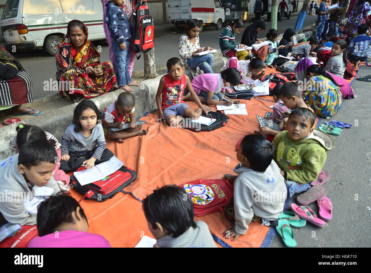 Dhaka, Bangladesh. 08th Jan, 2017. A group of street children studies ...