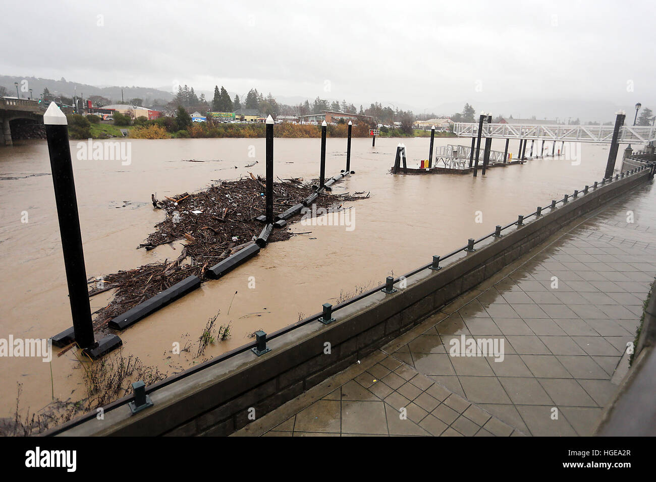 Napa, CA, USA. 8th Jan, 2017. Debris gathers near the downtown boat ...