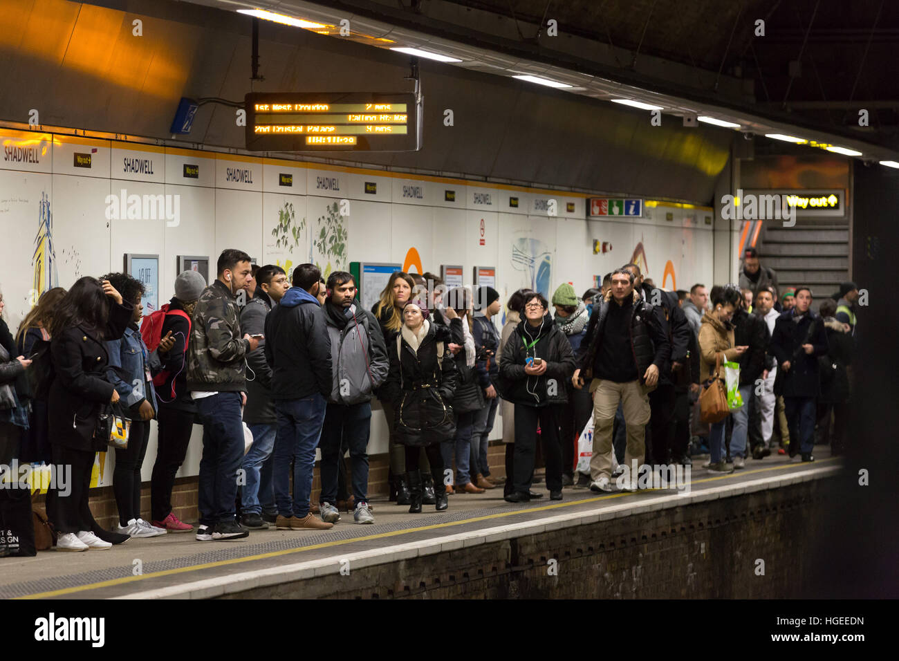London, UK. 9th Jan, 2017. People queue on a narrow platform for an ...