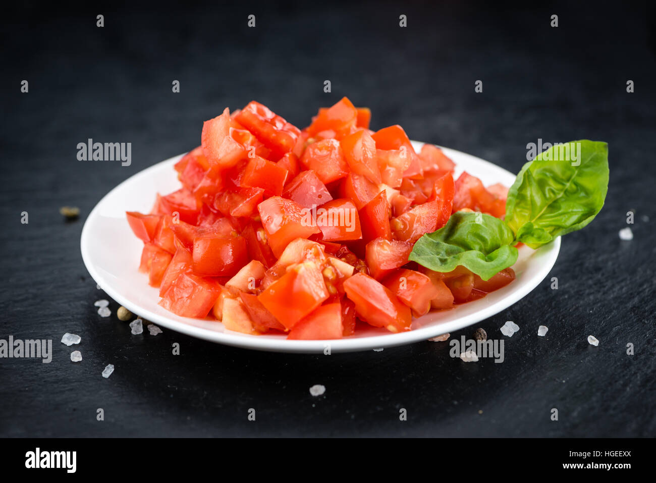 Some fresh Diced Tomatoes on a vintage slate slab (selective focus ...