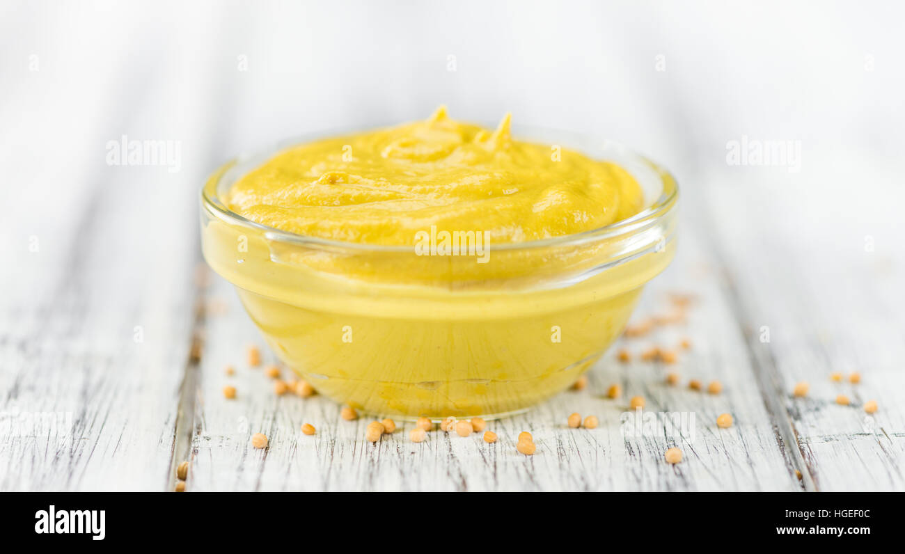 Fresh made Mustard on a vintage background (close-up shot Stock Photo ...