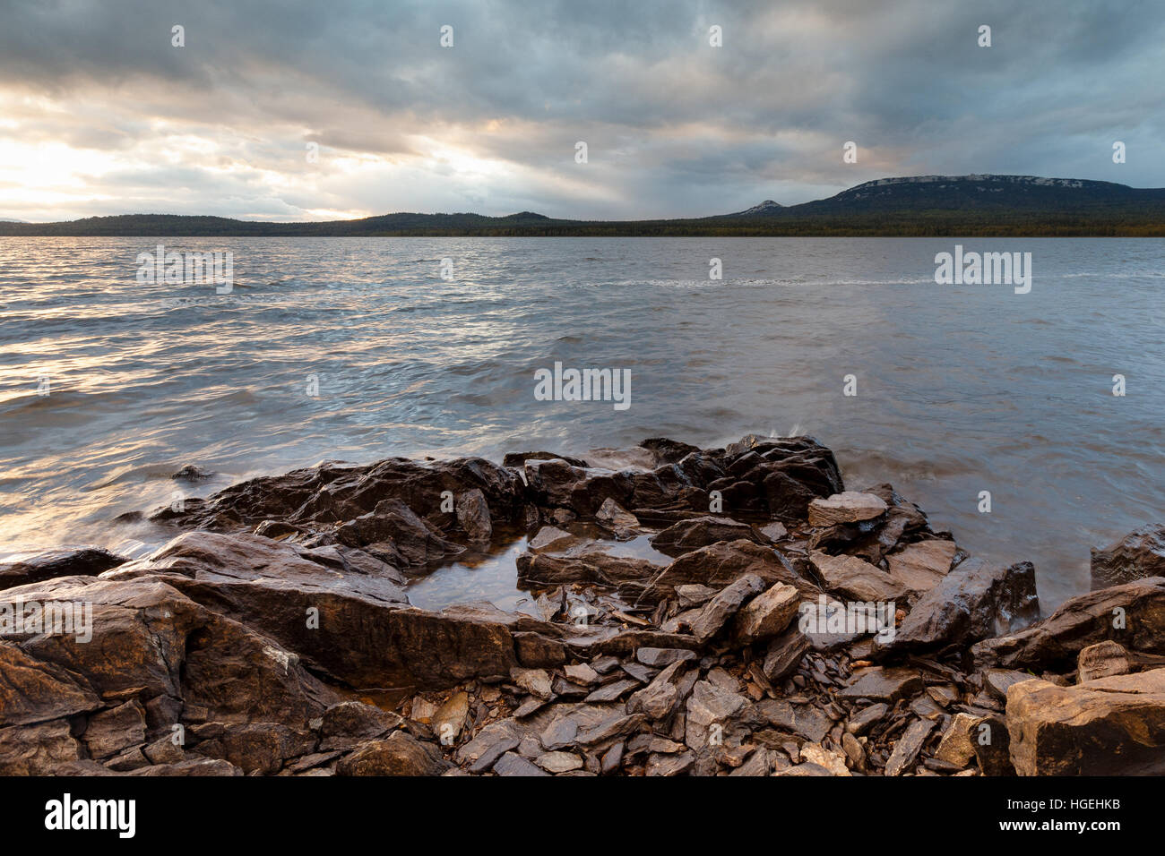 rocky coast stone waterfront sunset Stock Photo - Alamy