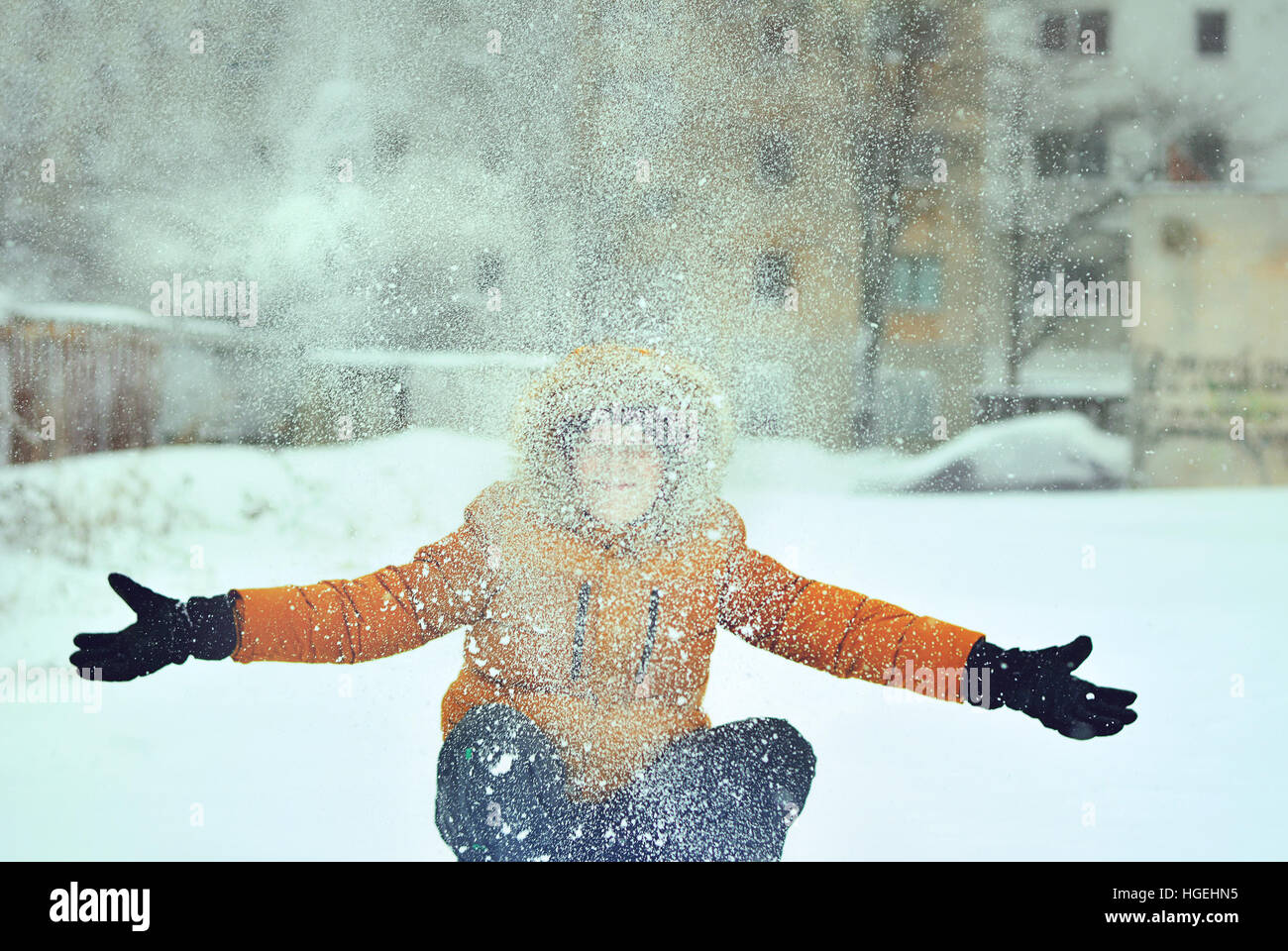 The magic of winter . Child having fun, playing with snow Stock Photo ...