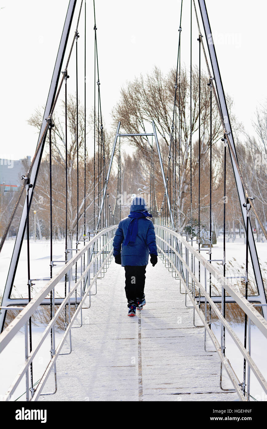 Walking on the bridge Stock Photo - Alamy