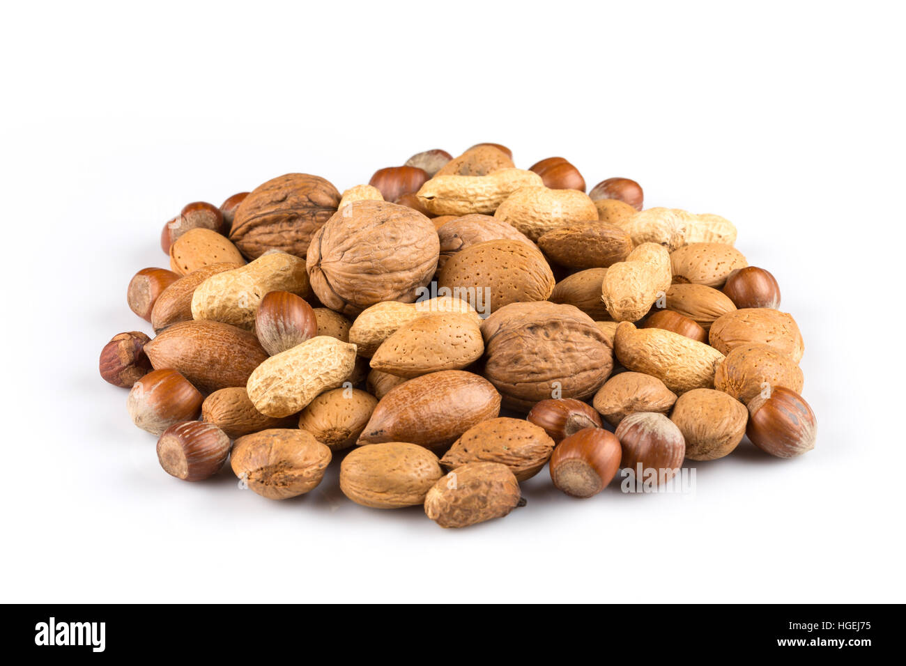 Mixed nuts in shells on a white background Stock Photo - Alamy