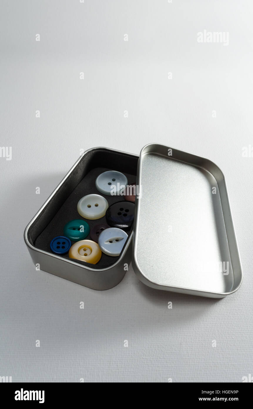 A Studio Photograph of a Metal Tin Constaining Assorted Buttons Stock ...